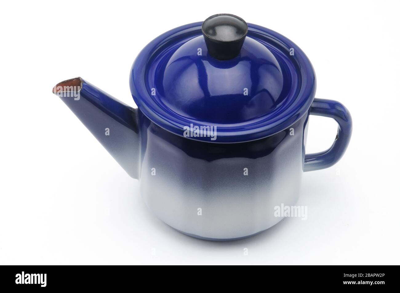 Vintage teapot in blue on an isolated white background Stock Photo - Alamy