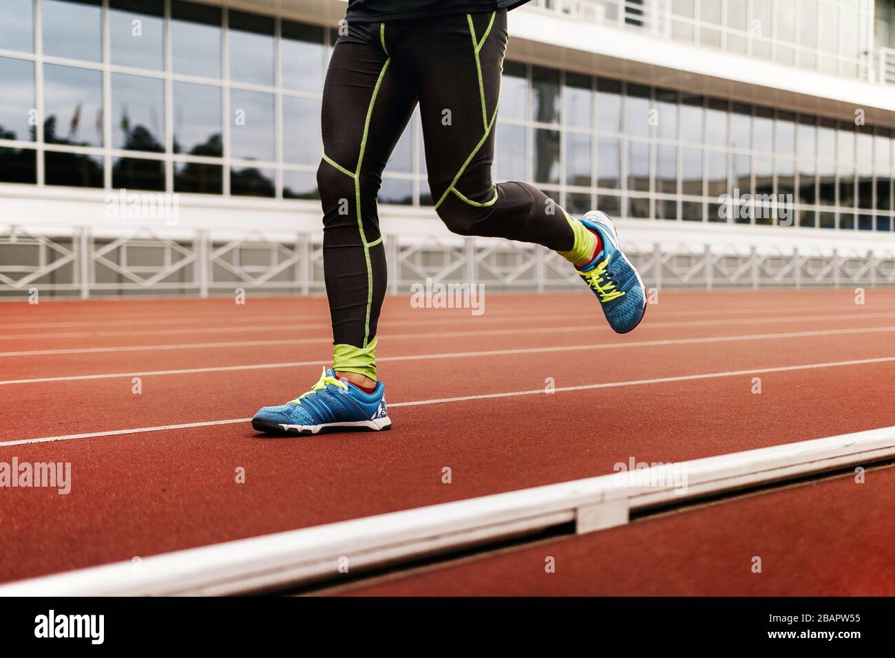 legs male runner run on red track of stadium Stock Photo - Alamy
