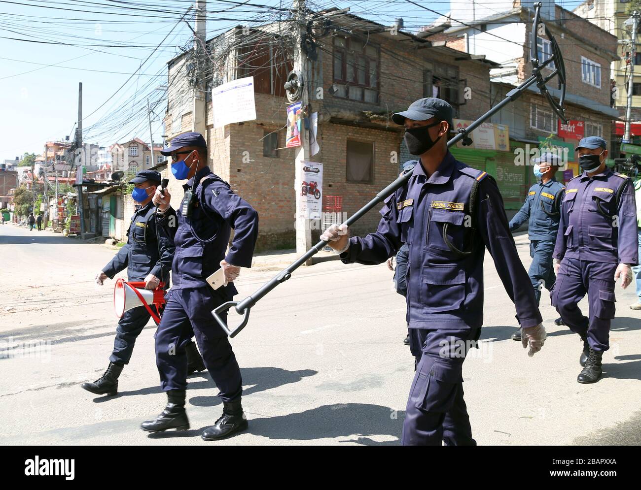 Kathmandu, Nepal. 29th Mar, 2020. Nepal police personnel patrol on a ...