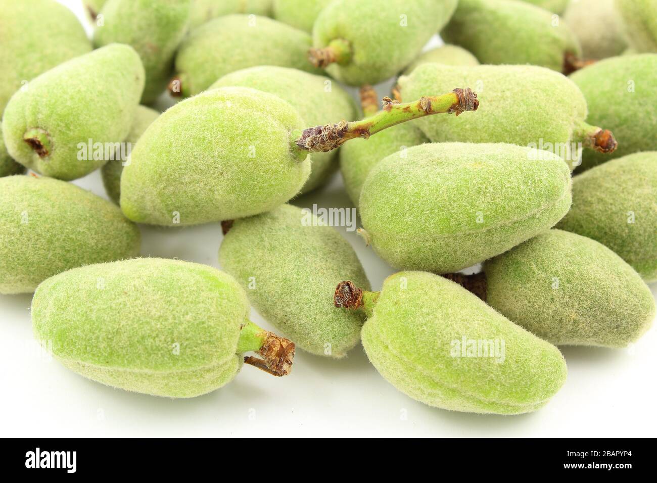 composition of fresh green almond fruits Stock Photo - Alamy