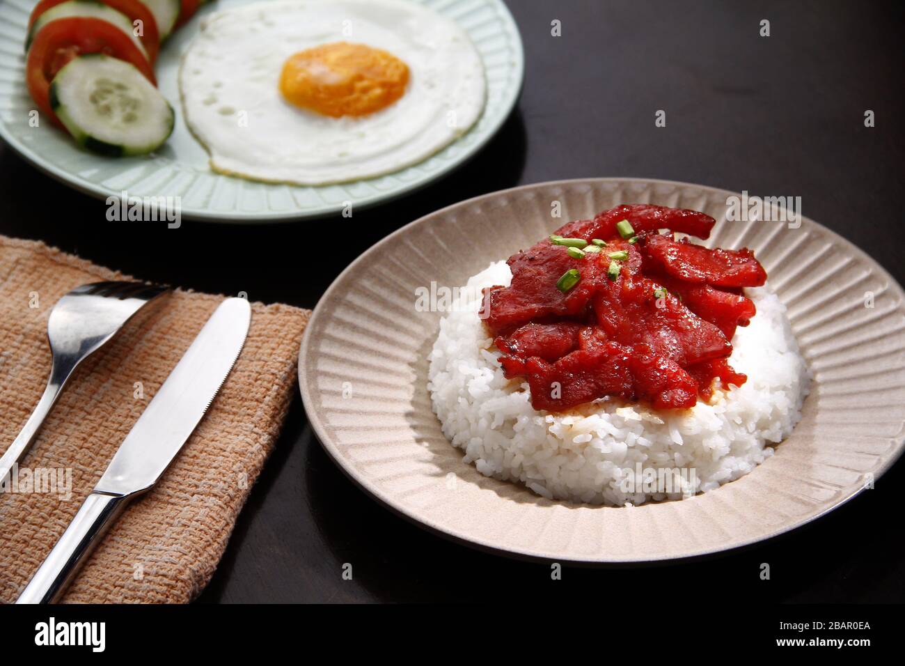 Photo of freshly cooked Tocino or cured pork meat served with fried ...