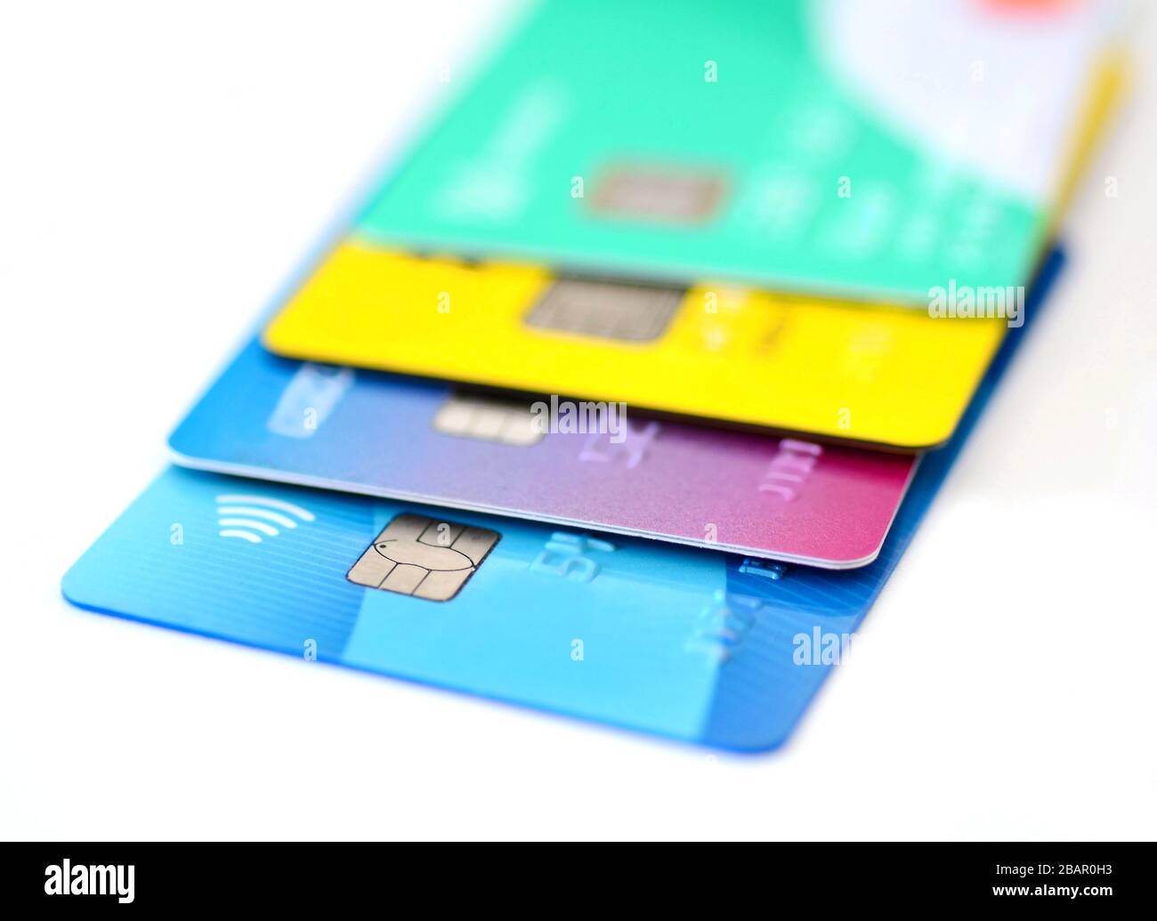 Stack of multicolored credit cards collection on white background Stock ...