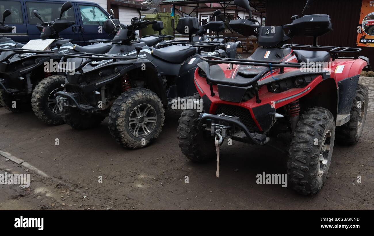 Ukraine, Yaremche - November 20, 2019: Many parked ATVs on a dirt road ...