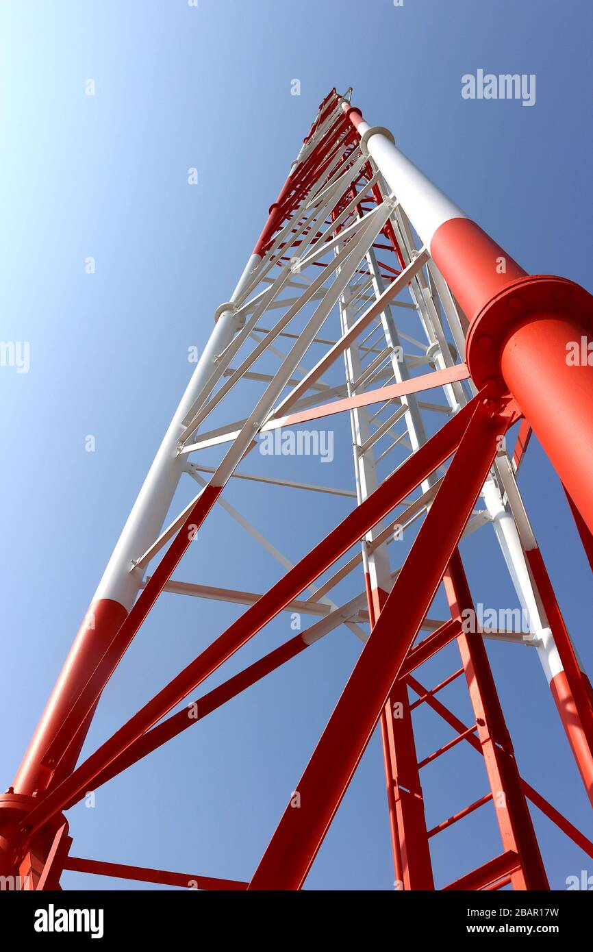 This ground-level photograph depicts the intricate steel framework of a ...