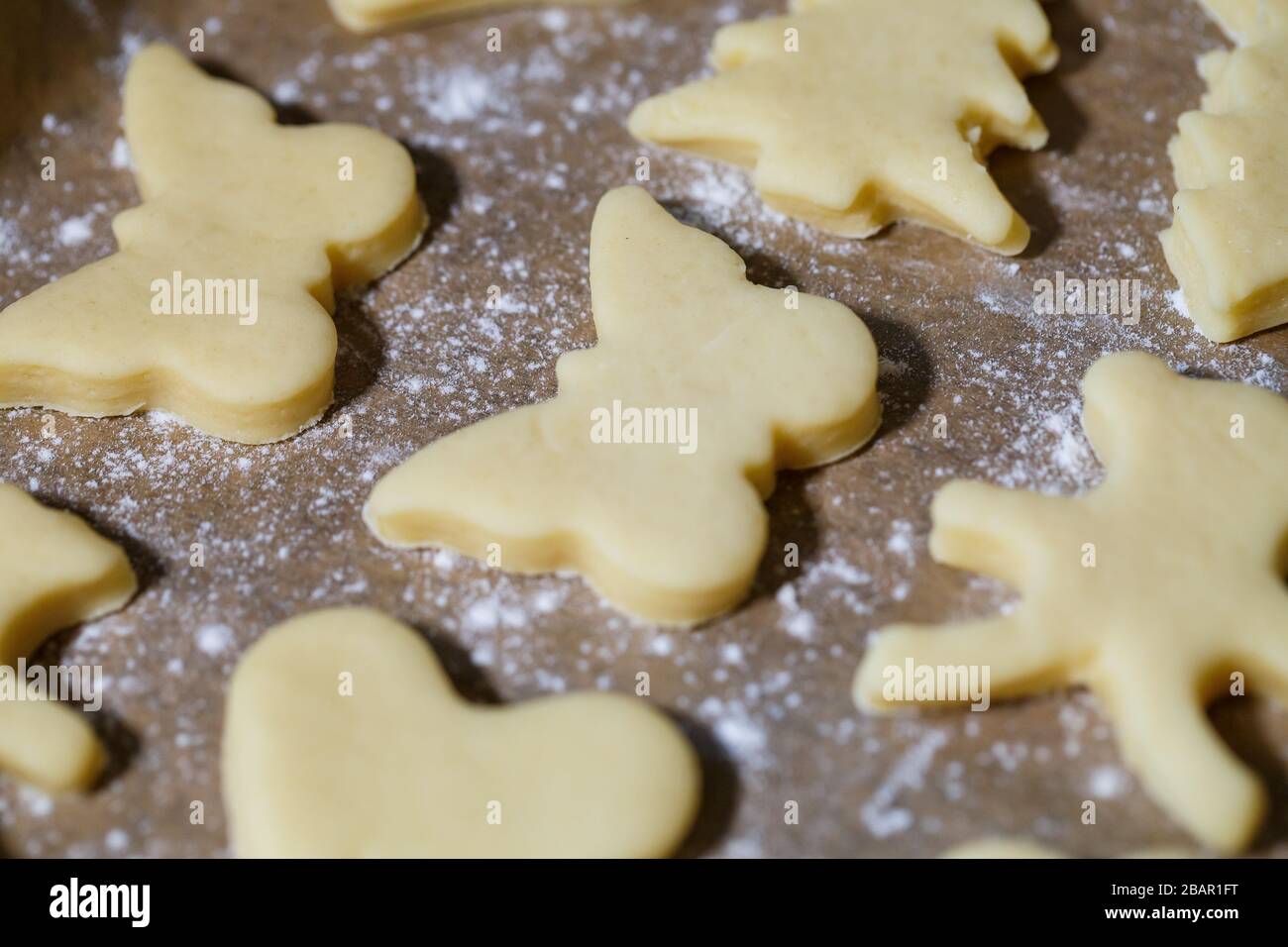 cooking homemade delicious cookies of different figures from the dough ...