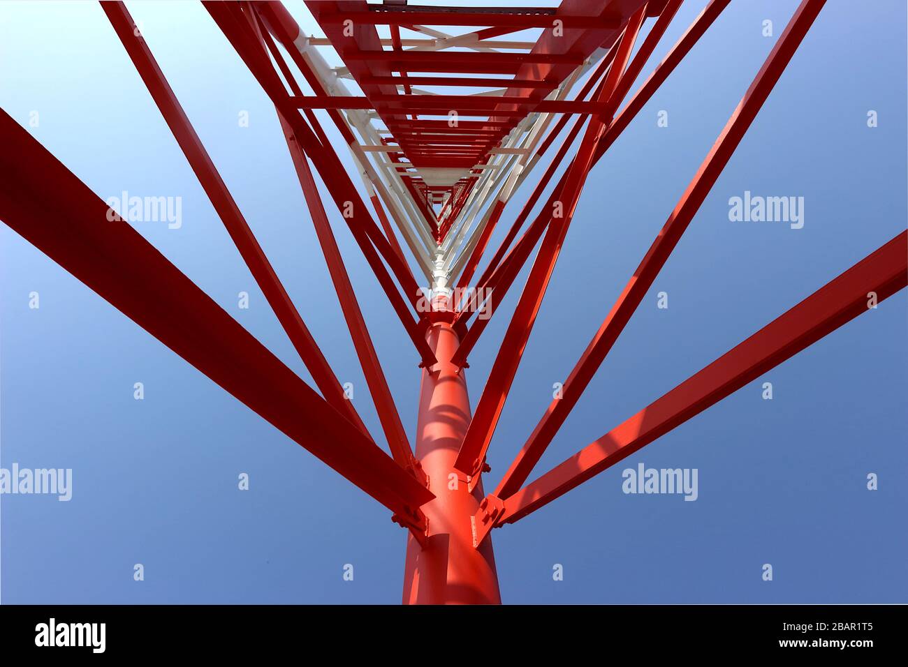 The photograph offers an upward perspective of a telecommunications ...
