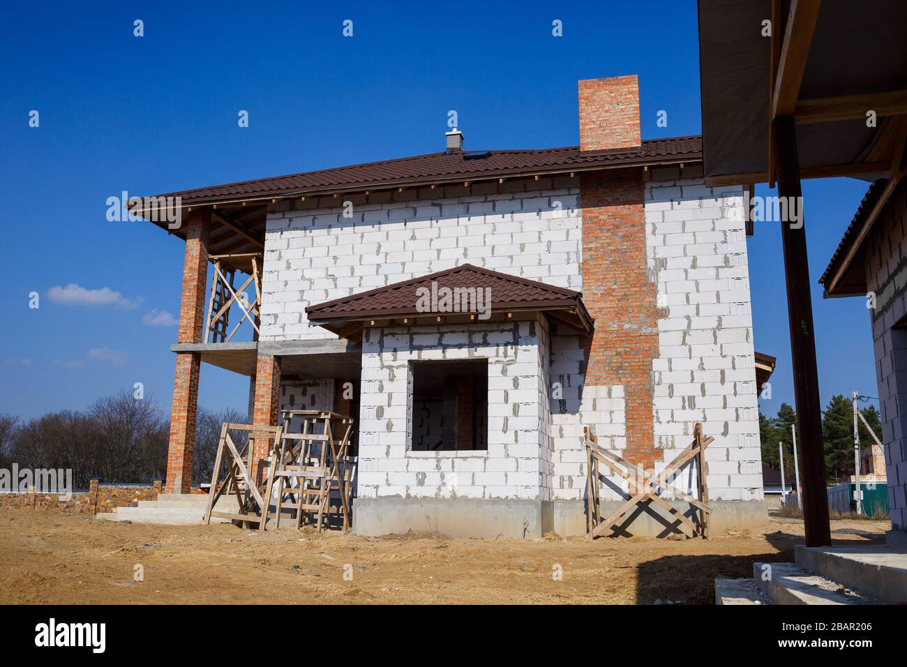 construction of a country two-story house from a gas block Stock Photo ...