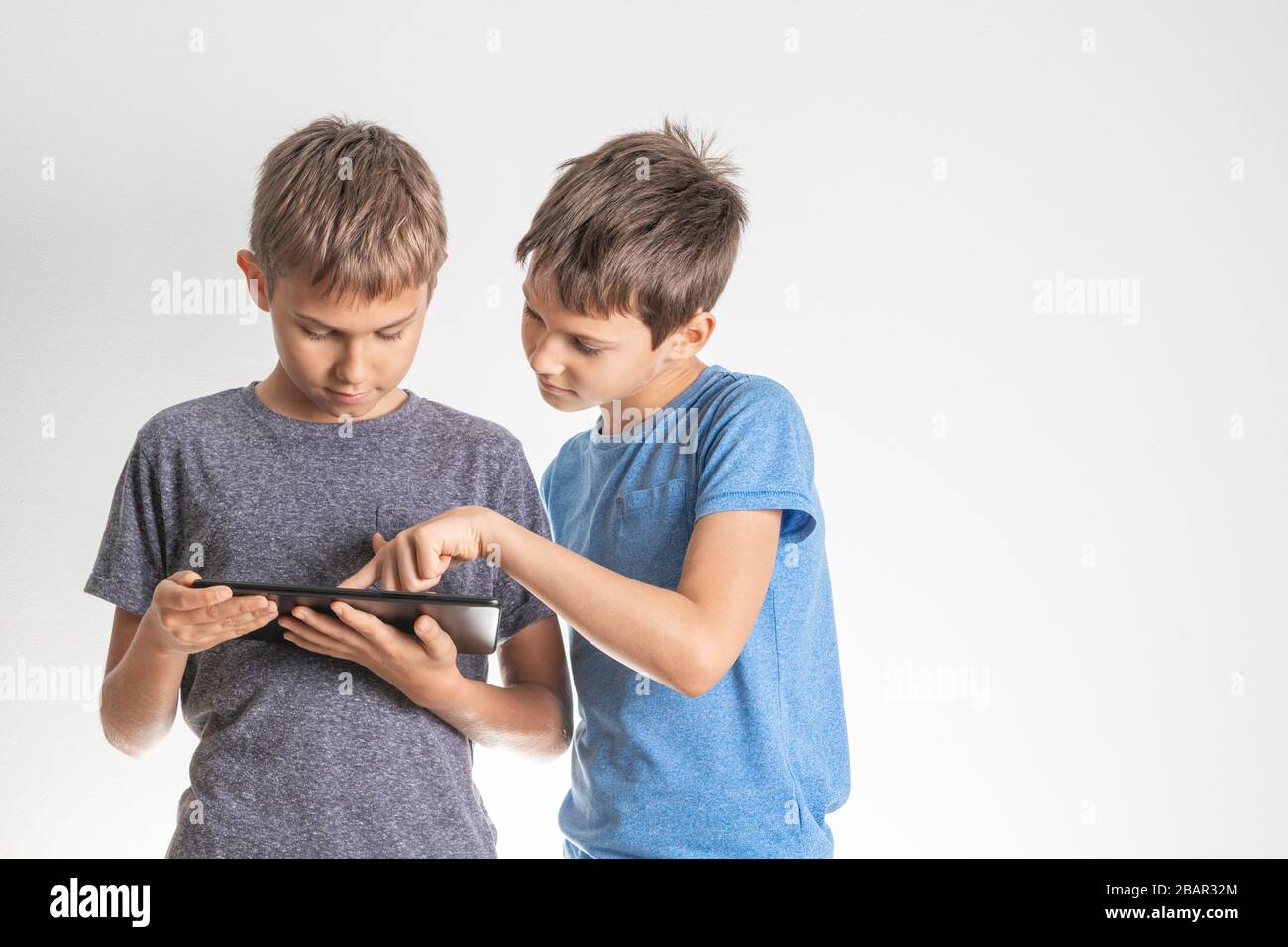 Children using digital tablet pc computer. Technology, online learning ...