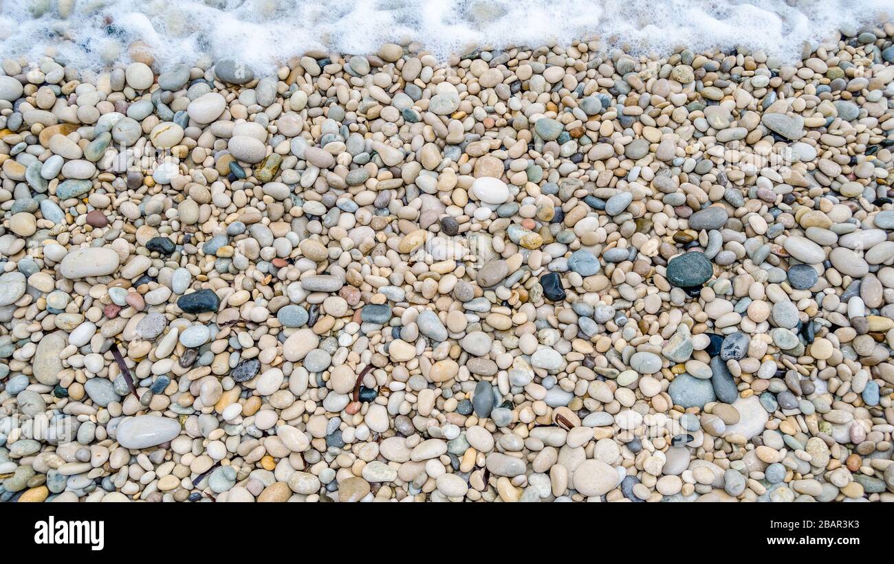 Background of colorful stones on a beach Stock Photo - Alamy
