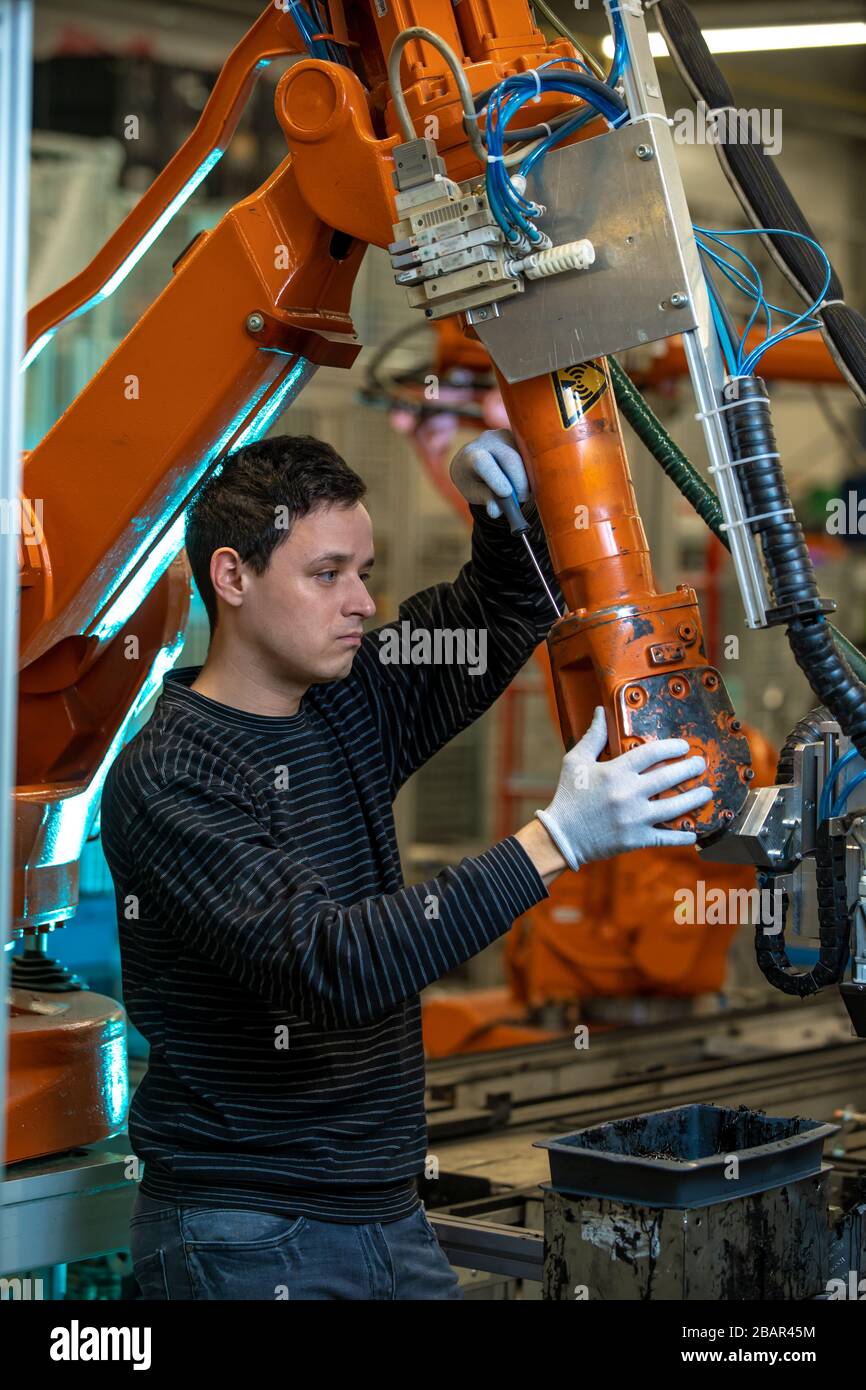 basic maintenance of robotic arms in the factory Stock Photo - Alamy