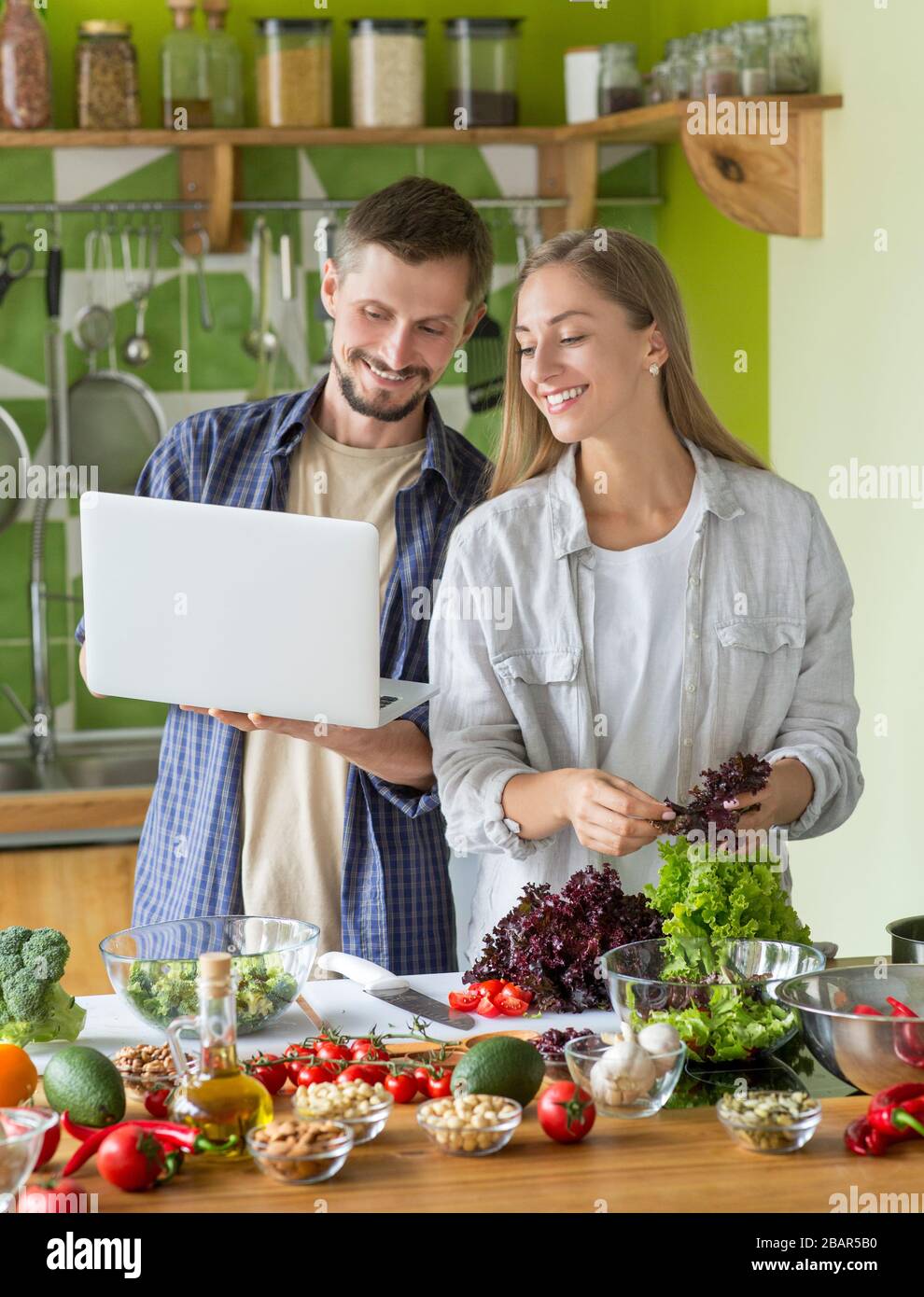 Video happy caucasian couple cooking hi-res stock photography and ...