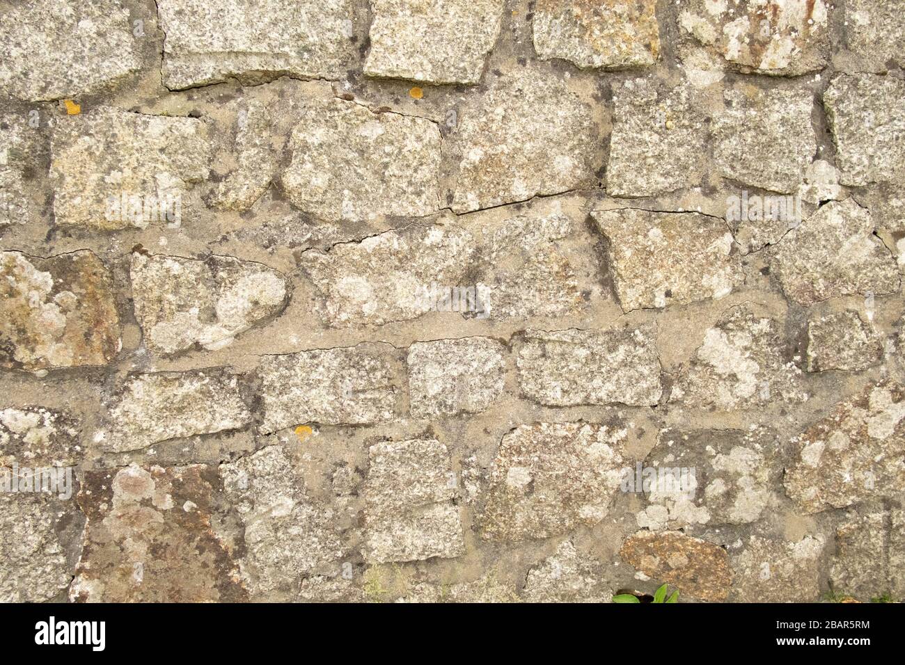 Close up of a stone retaining wall with different shape stones ...