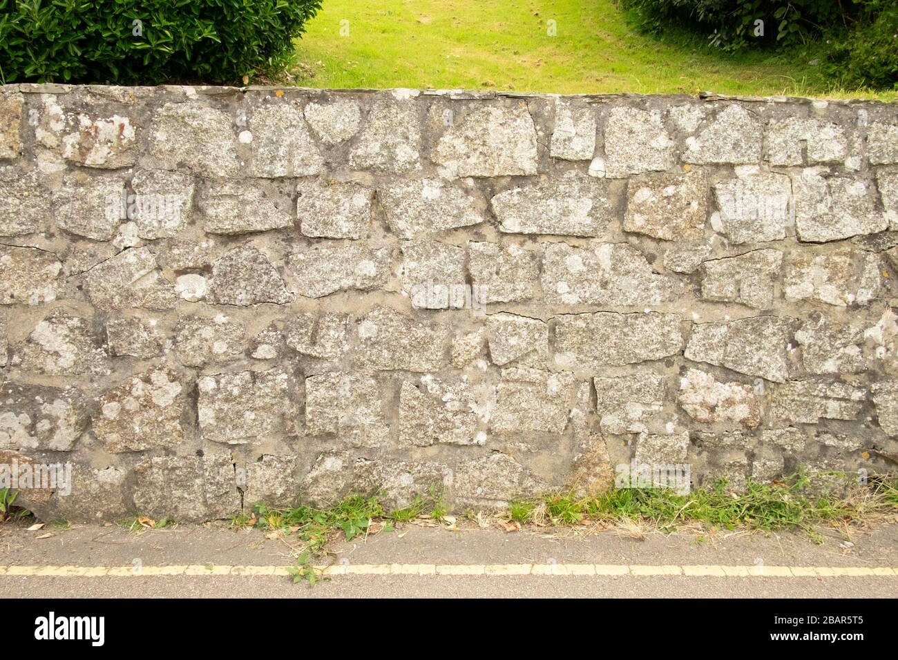 Stone retaining wall with different shape stones, Cornwall, England ...