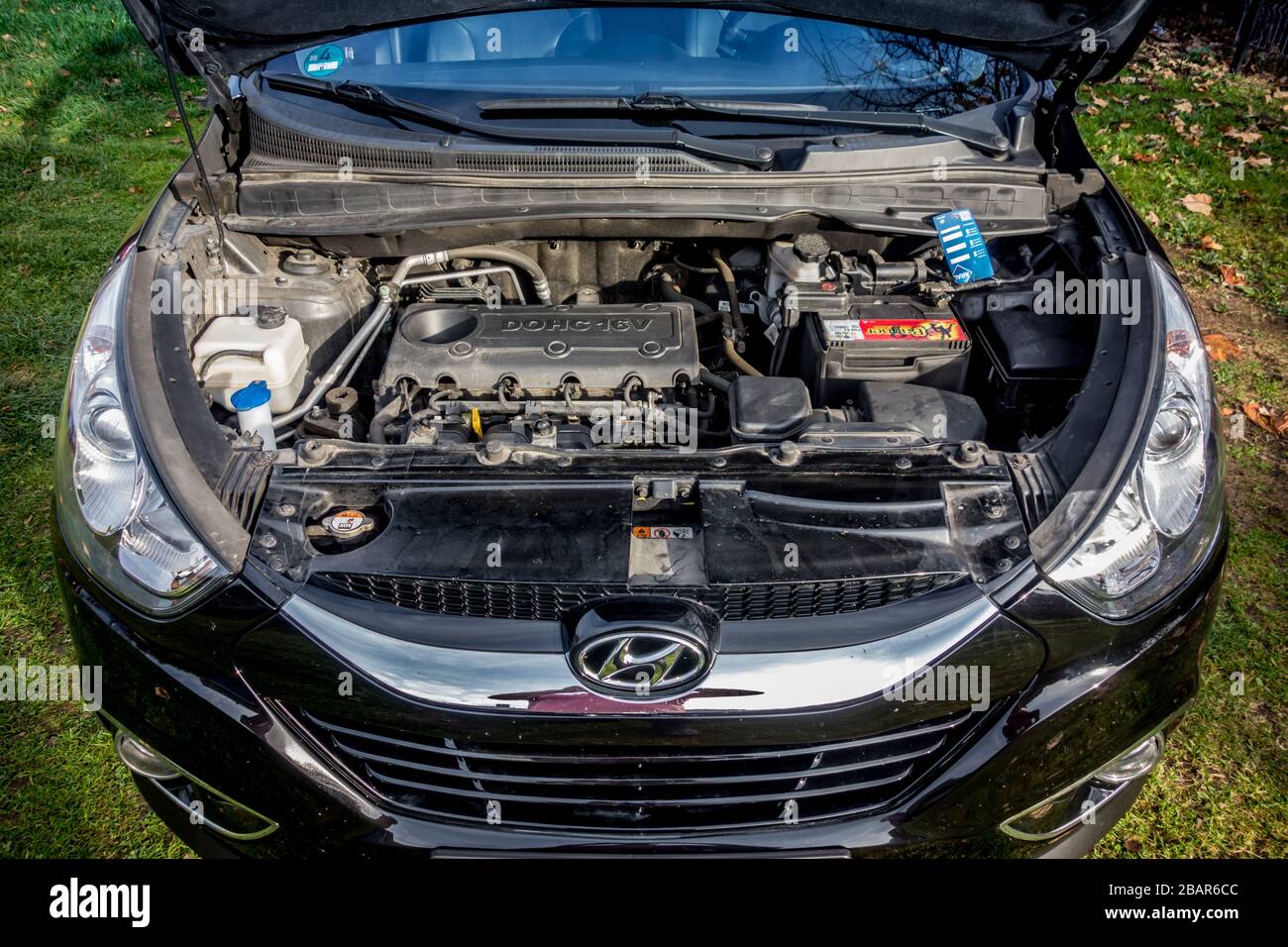 Car with hood cracked up/opened - engine repair by mechanic. Engine ...