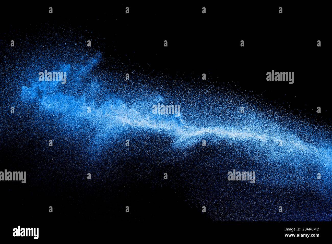 Blue color dust particles explosion cloud on black background.Color ...