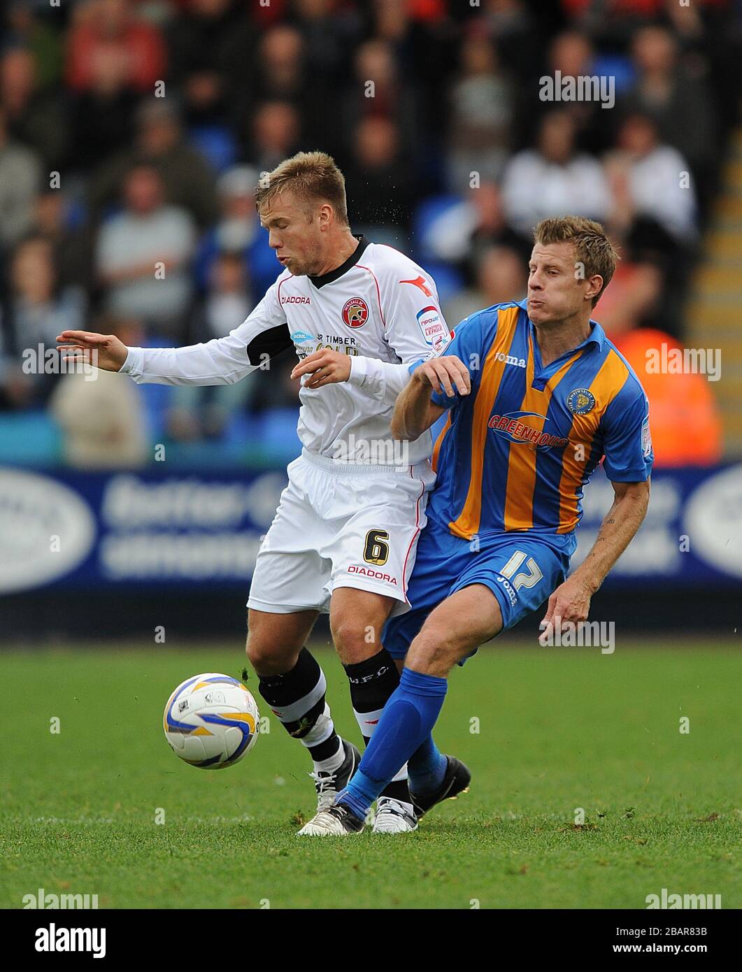 Shrewsbury Town's Paul Parry (right) and Walsall's Nicky Featherstone ...