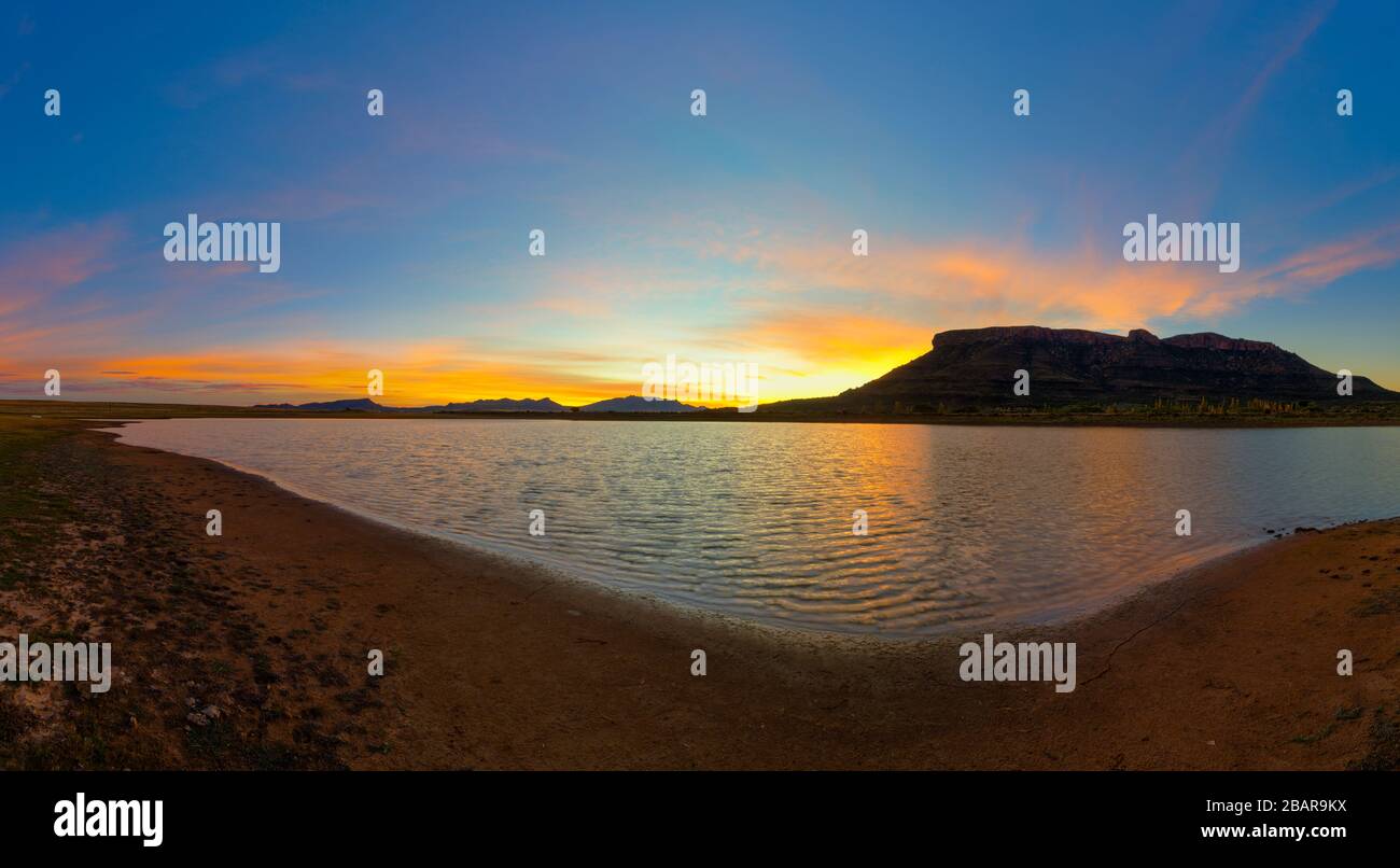 Reflection of sunset on water Stock Photo - Alamy