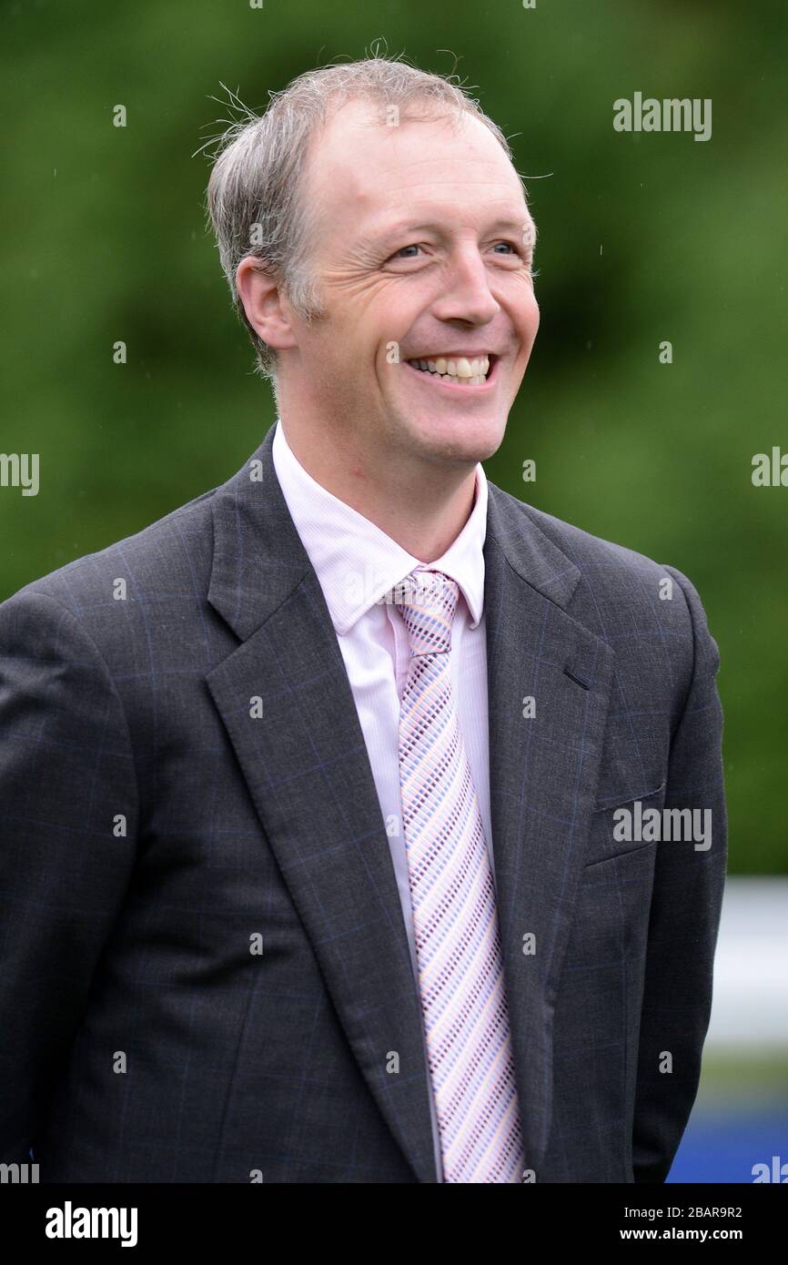Grand Crus trainer David Pipe is interviewed in the parade ring Stock ...