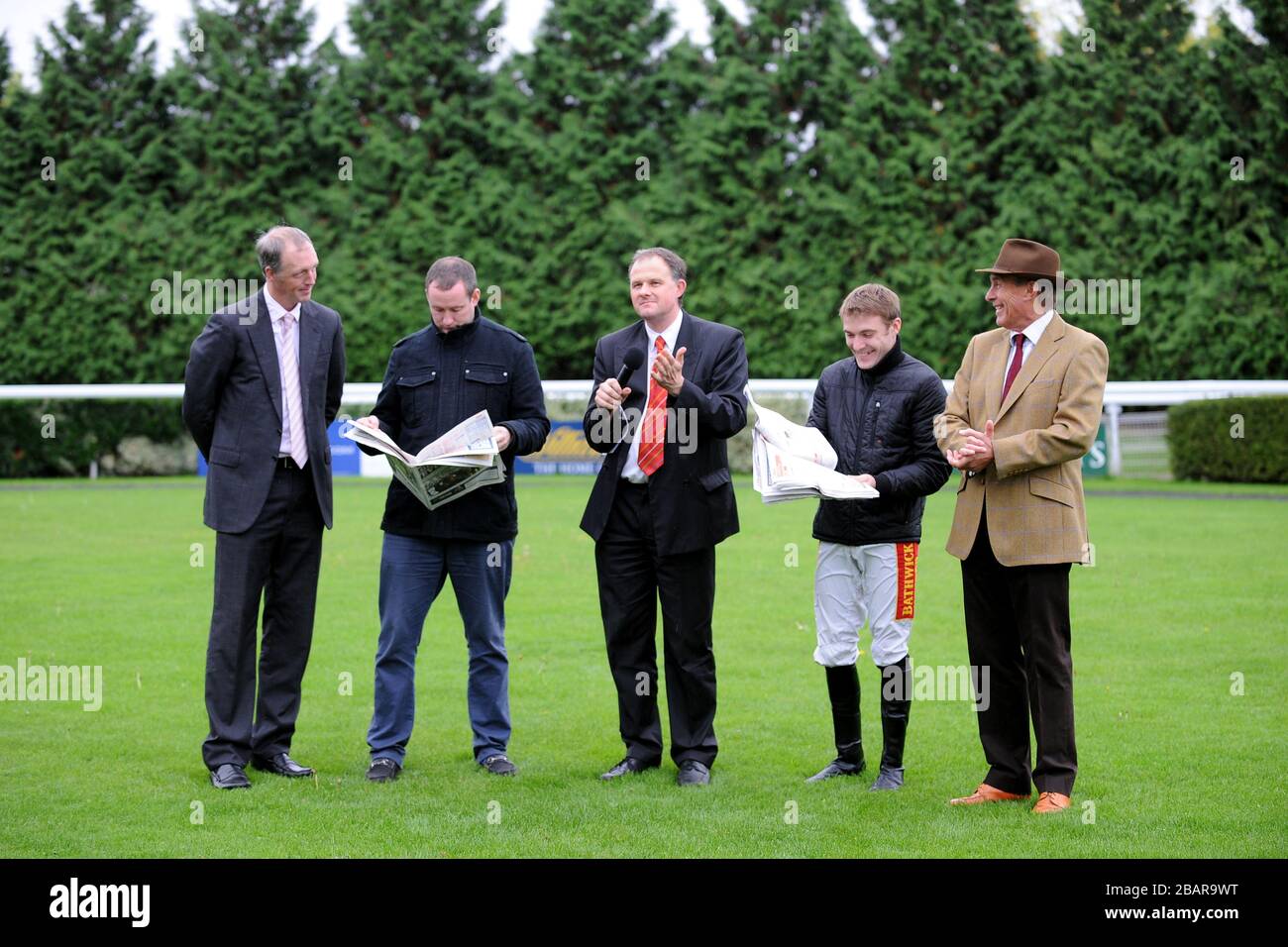 Grand Crus trainer David Pipe (far left), jockey Tom Scudamore (second ...