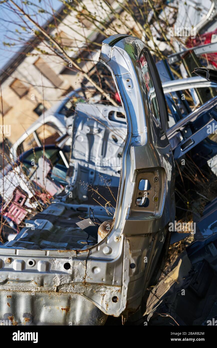 old gray car frame disassembled car with rusty parts on the street near ...