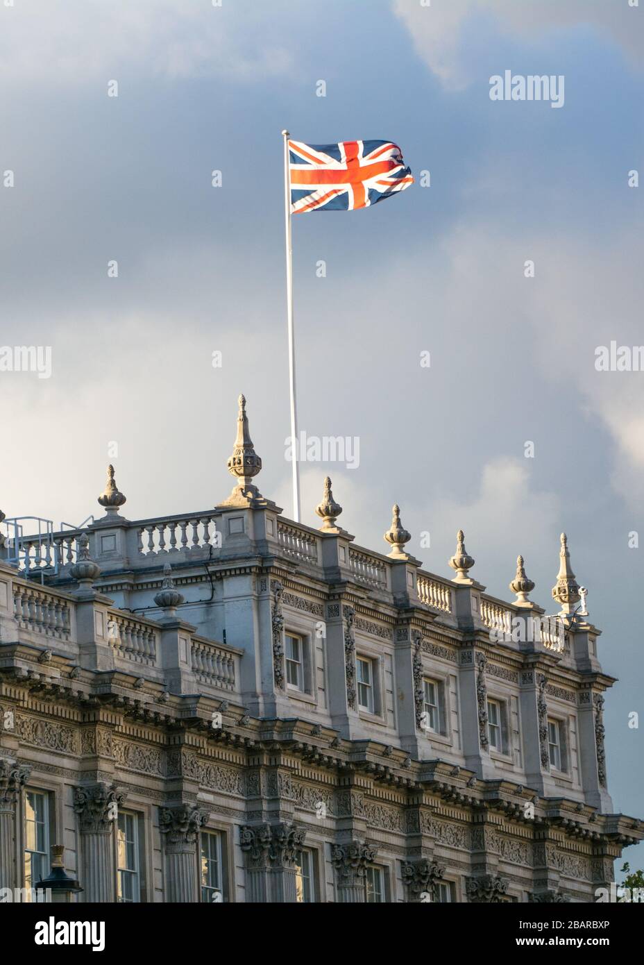 British government building with Union Jack flying above Stock Photo ...