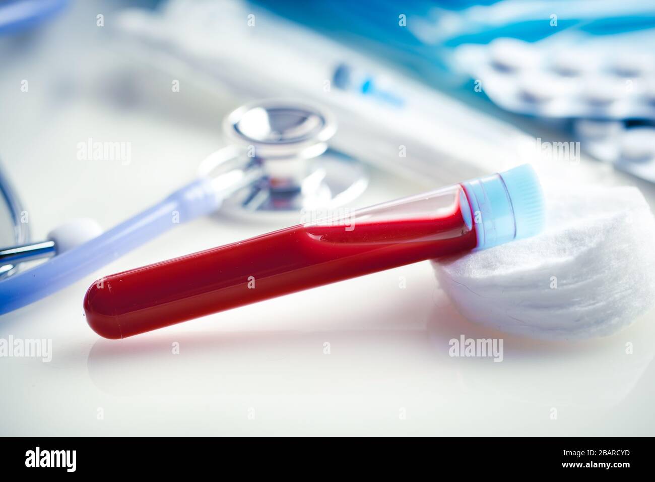 A test tube with a blood test in a medical laboratory. Background with ...