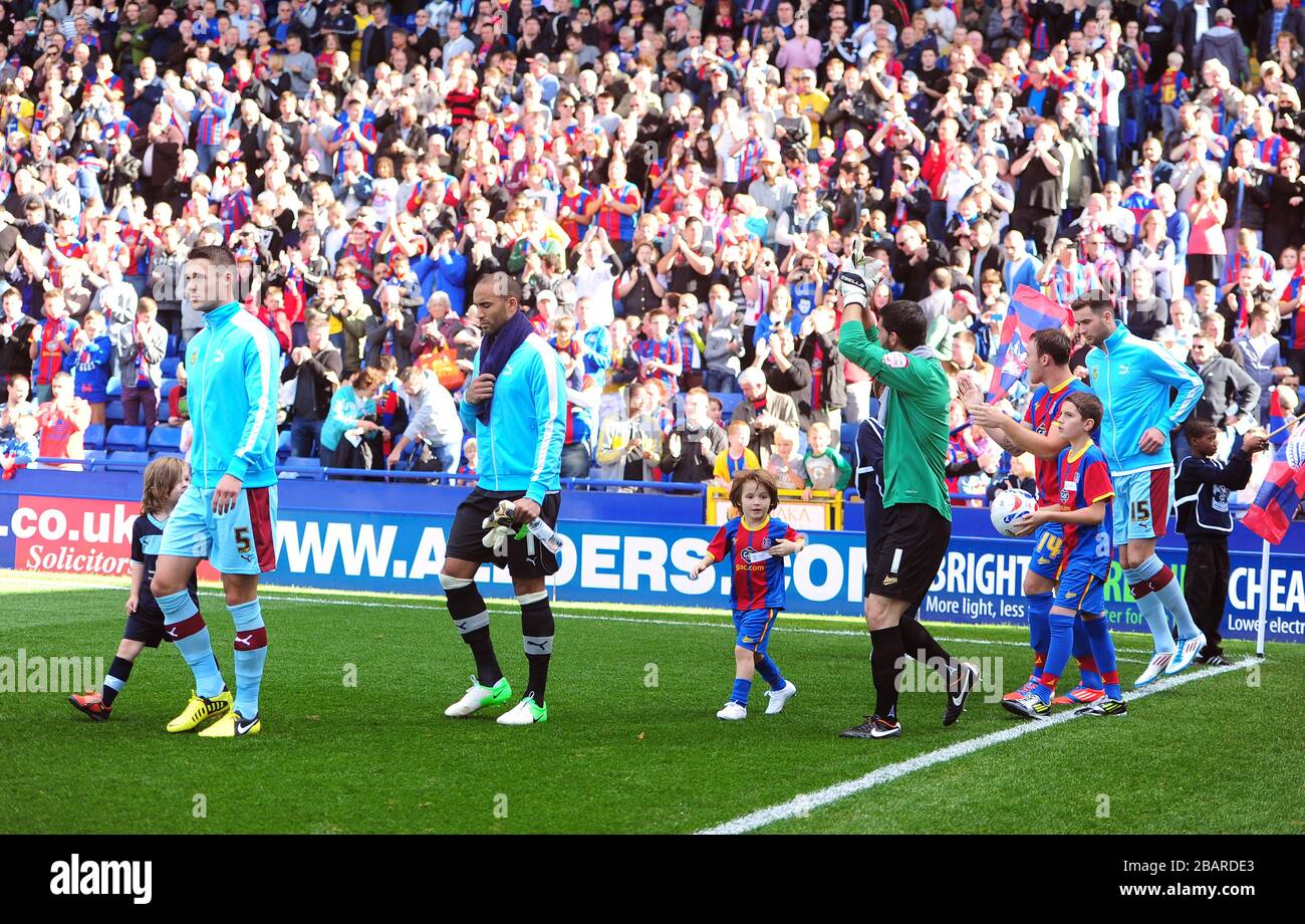 The two team's walk out onto the pitch Stock Photo - Alamy