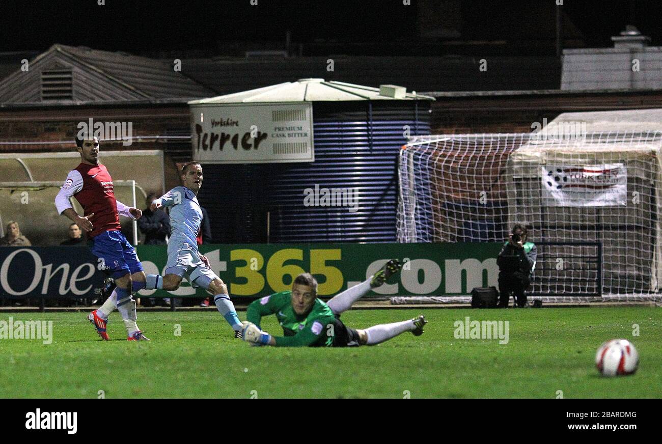 Coventry City's Chris Hussey (centre) scores his side's fourth goal of ...