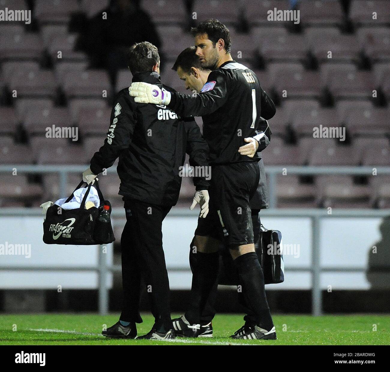 Northampton Town's Shane Higgs leaves the pitch injured Stock Photo - Alamy