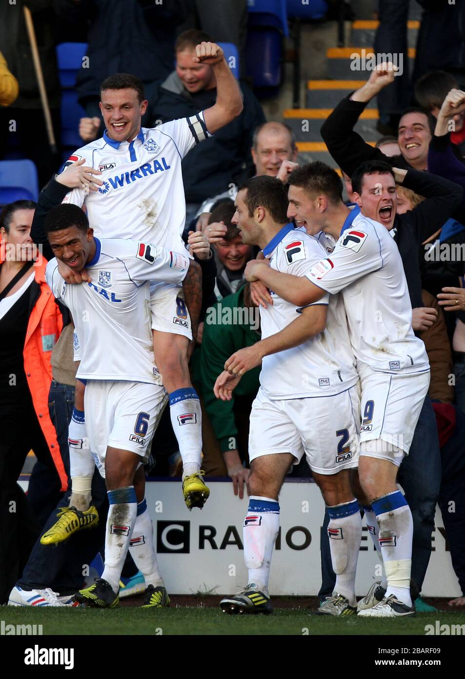 Tranmere Rovers' Danny Holmes (no 2) is congratulated on scoring the ...