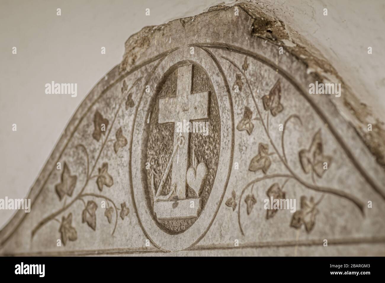 Closeup shot of a sculptured cross with a blurred background Stock ...