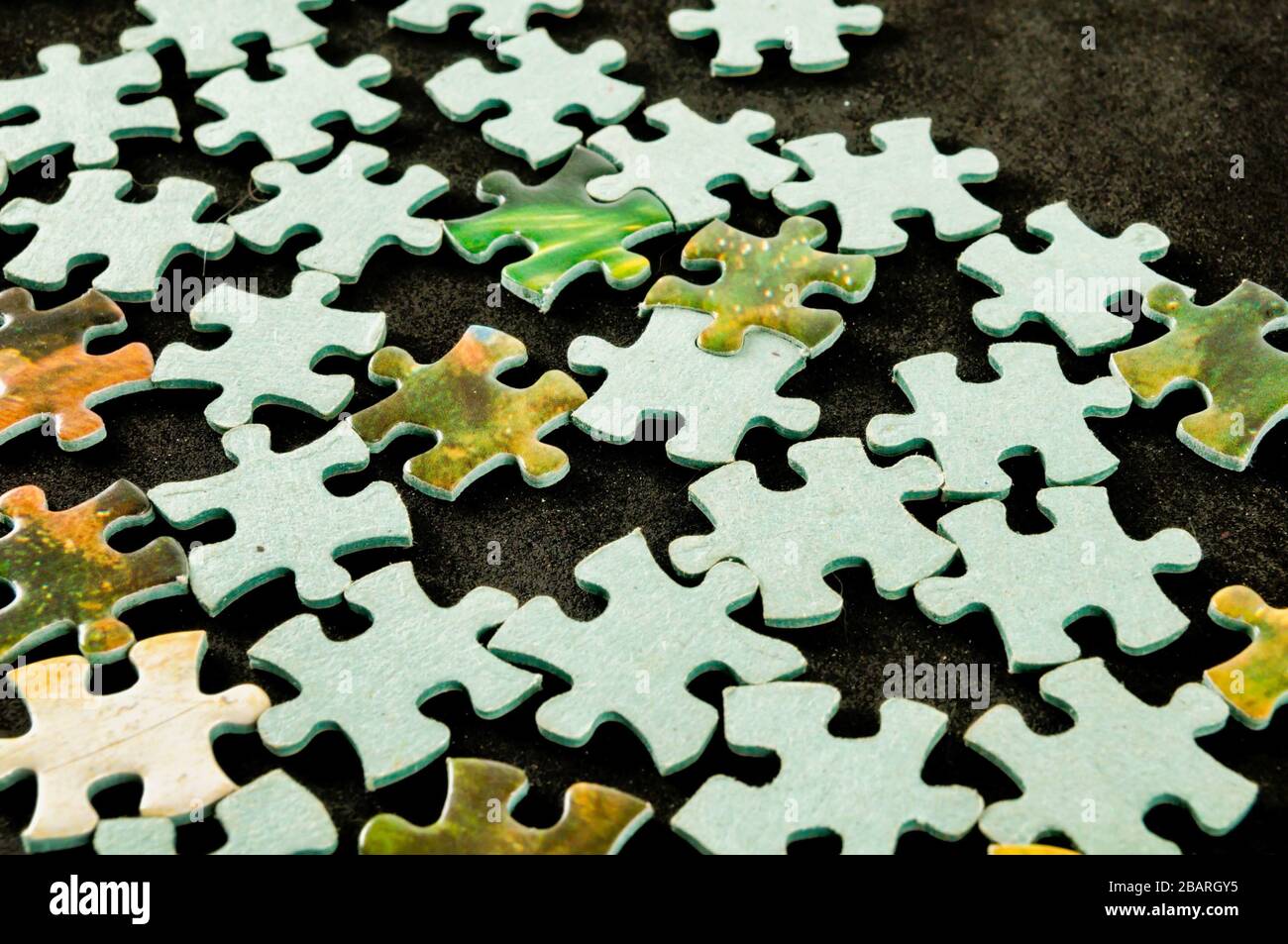 Pieces of a jigsaw puzzle next to each other Stock Photo - Alamy