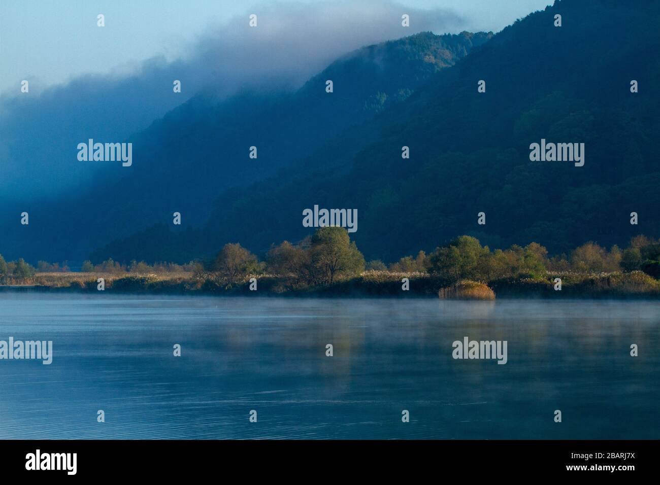 Misty morning sunrise over the bay and river of Toyooka (Toyooka-shi ...