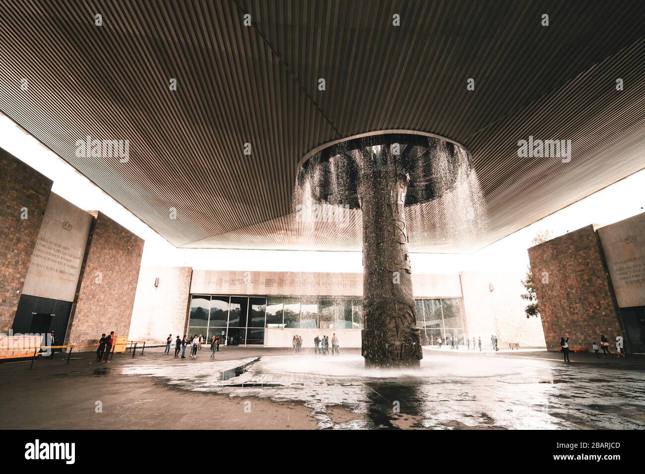 Low angle shot of beautiful modern artificial waterfalls of a building ...