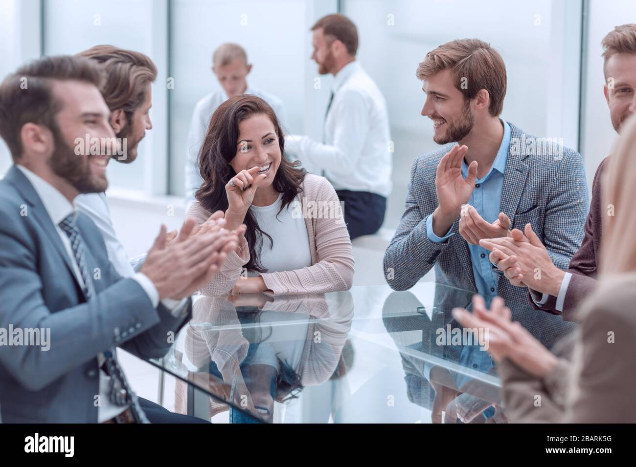confident business woman explaining something to her business partners ...