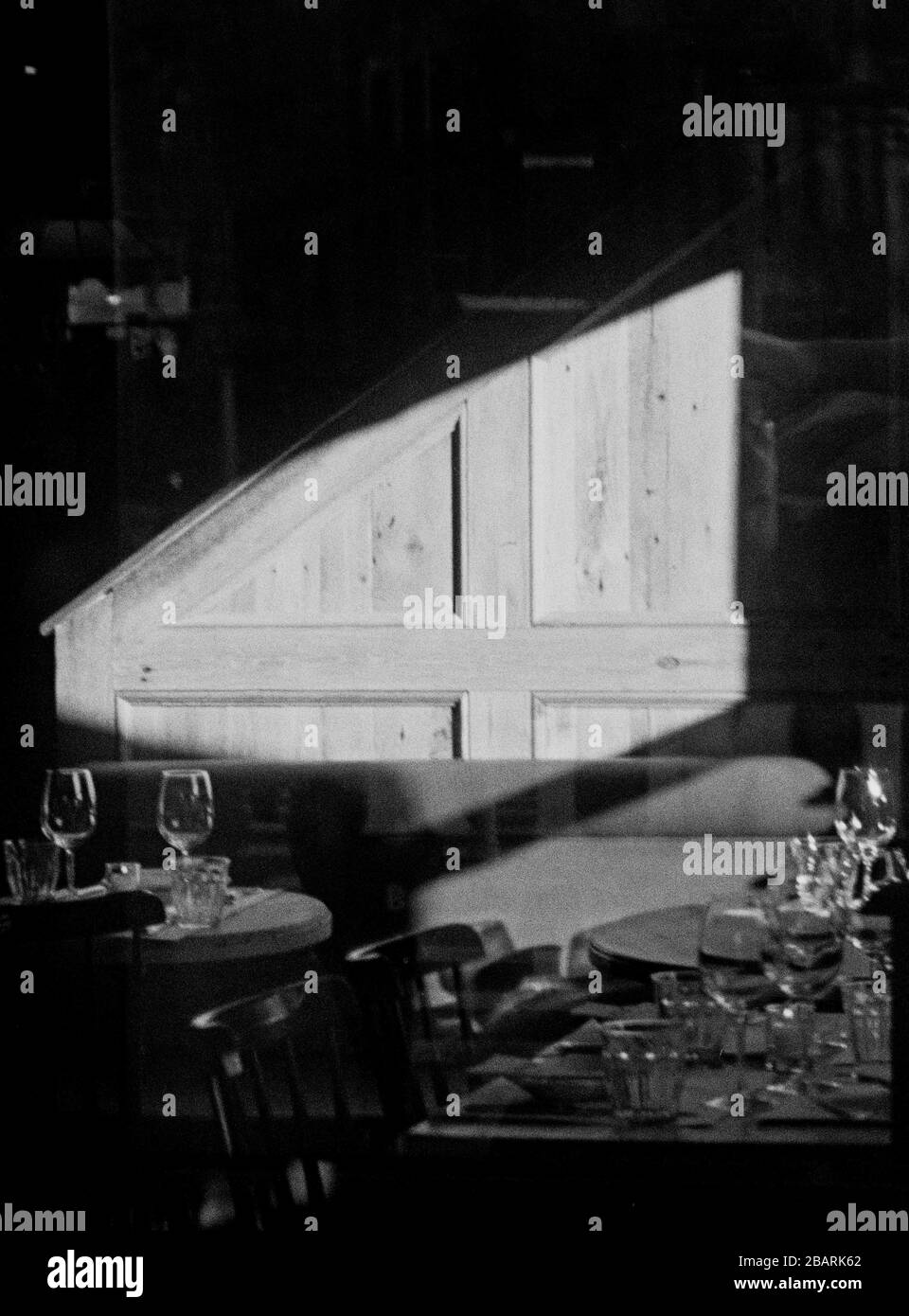 Vertical grayscale shot of dining tables inside the restaurant Stock ...