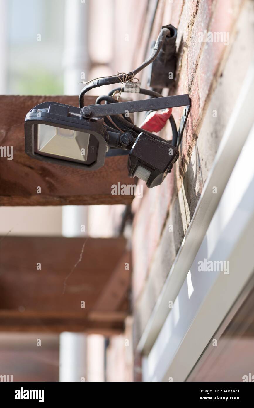 Sensor triggered outdoor security light Stock Photo - Alamy
