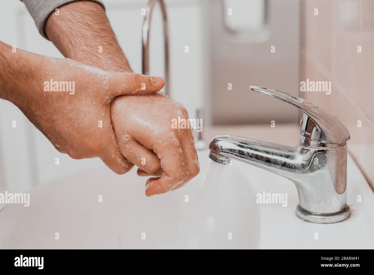 Washing hands rubbing with soap man for corona virus prevention ...