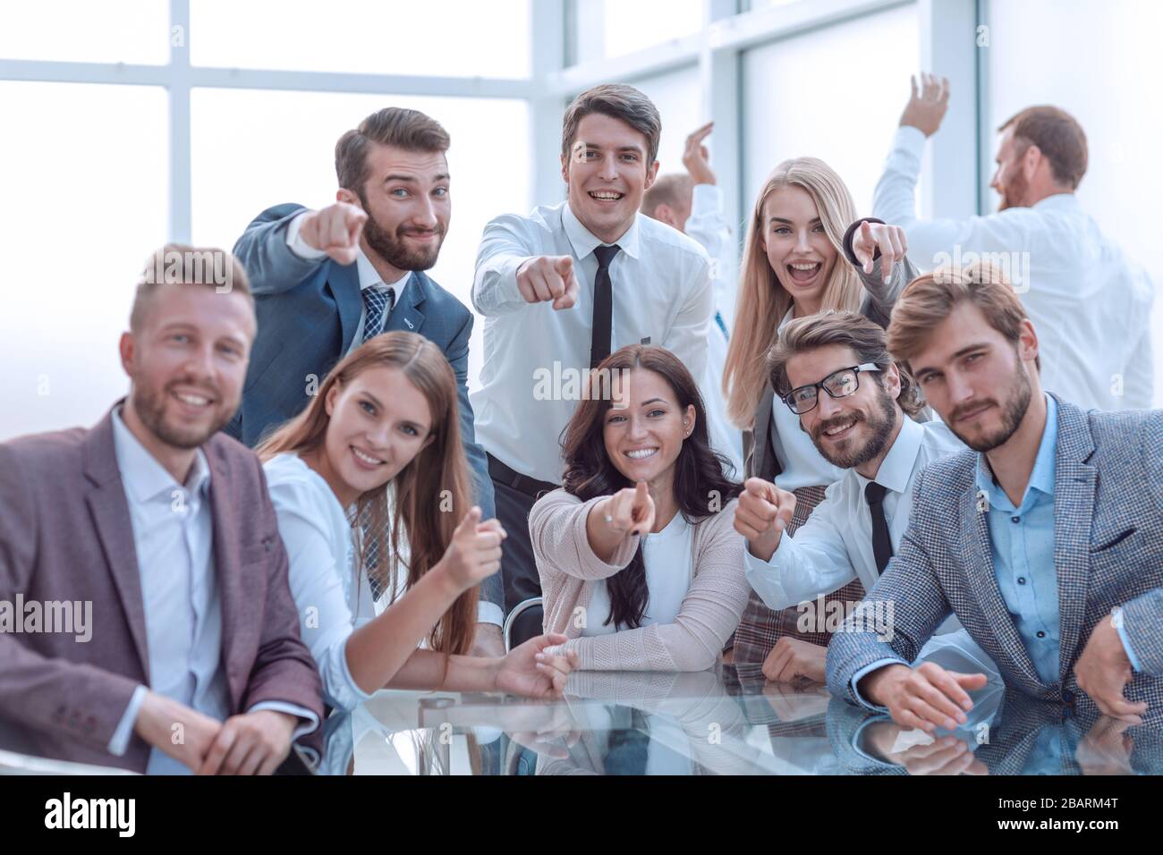group of young employees are pointing at you Stock Photo - Alamy