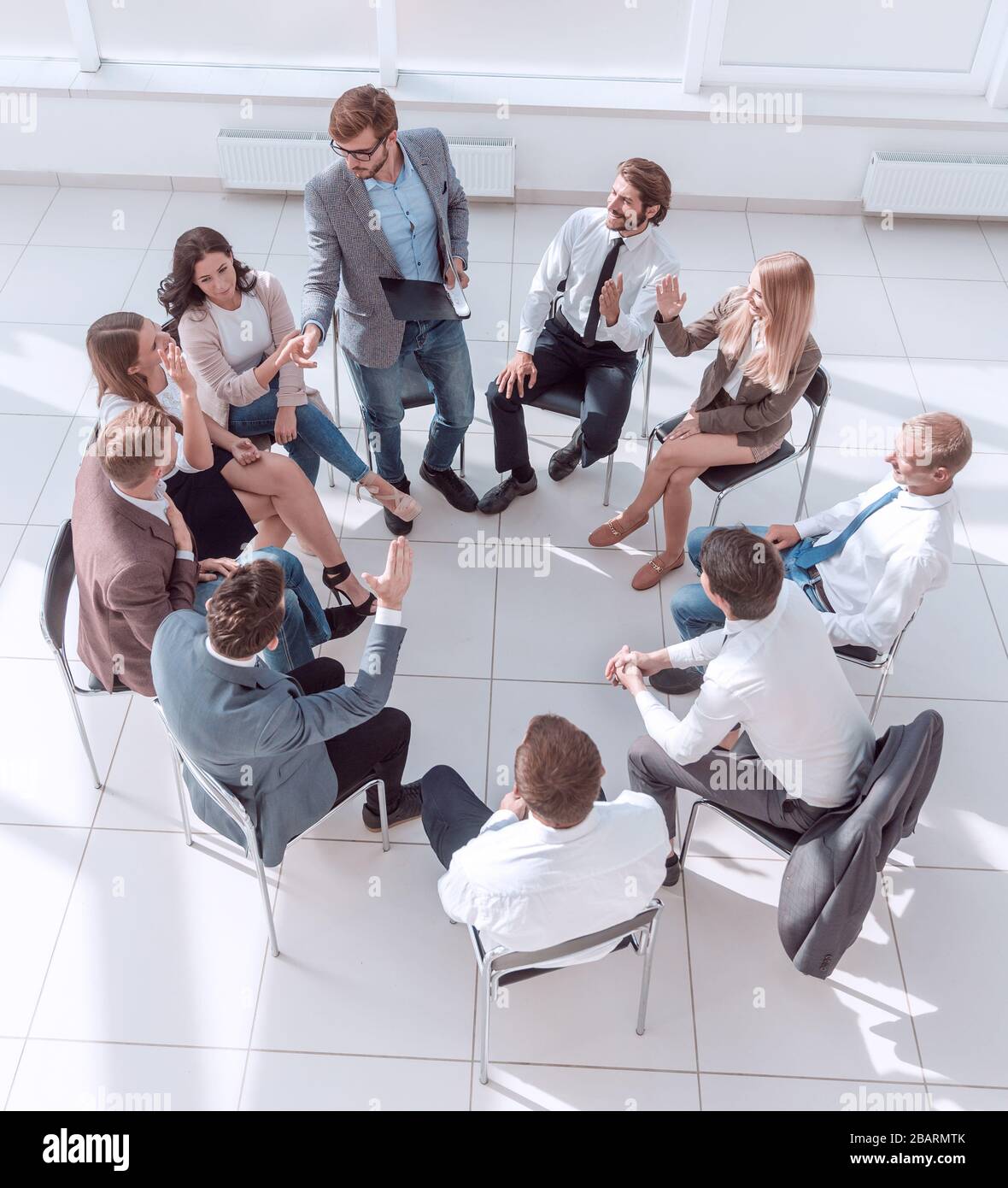 young employees ask questions during business training Stock Photo - Alamy