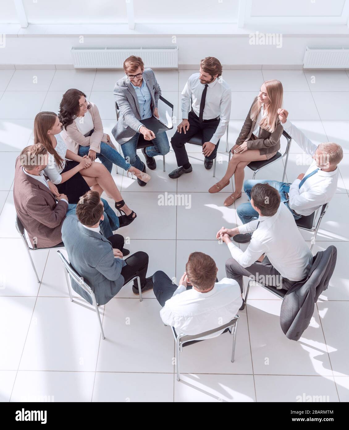 young employees ask questions during business training Stock Photo - Alamy