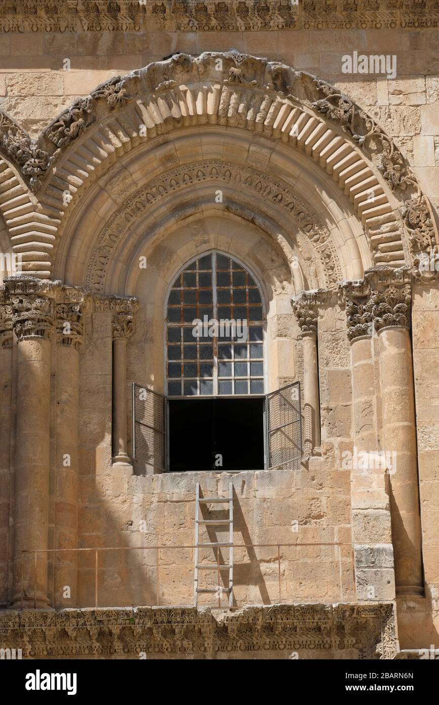The immovable ladder which leans against a window ledge in the upper ...