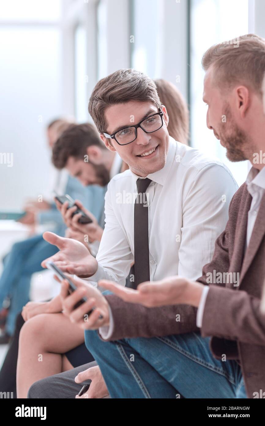 close up. employees using smartphones to find the right information ...