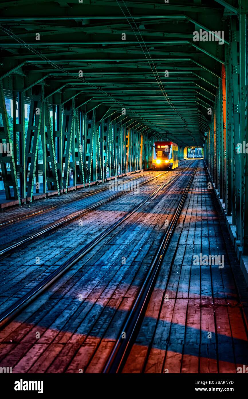 Tramway track with incoming tram rail vehicle on lower part of double ...