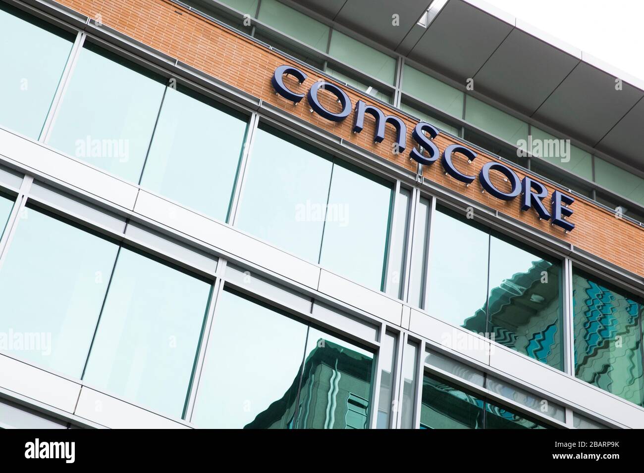 A logo sign outside of the headquarters of Comscore in Reston, Virginia ...