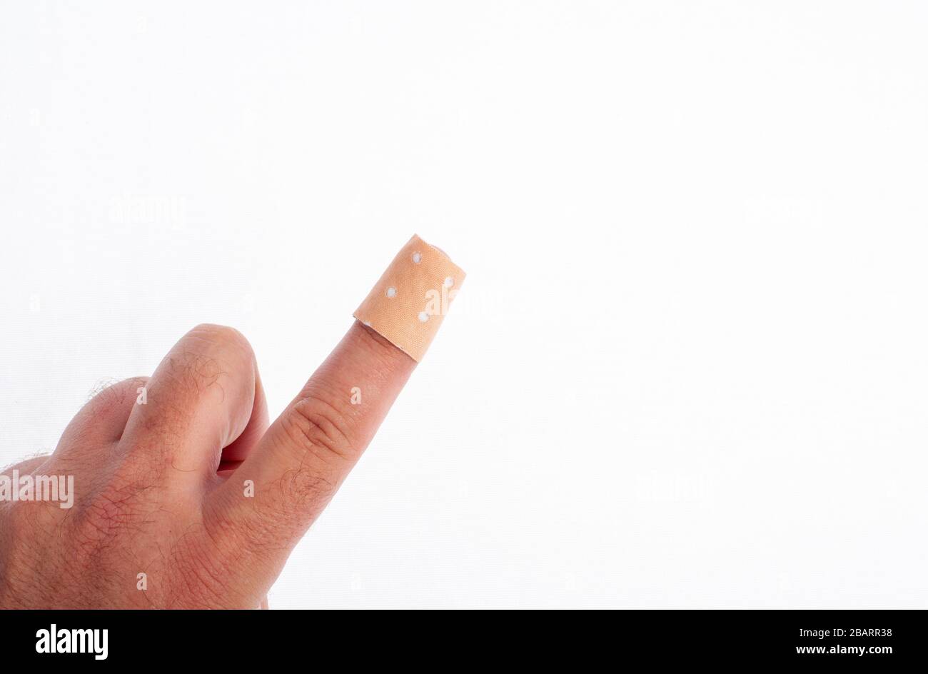 close-up of finger with plaster on white background Stock Photo - Alamy