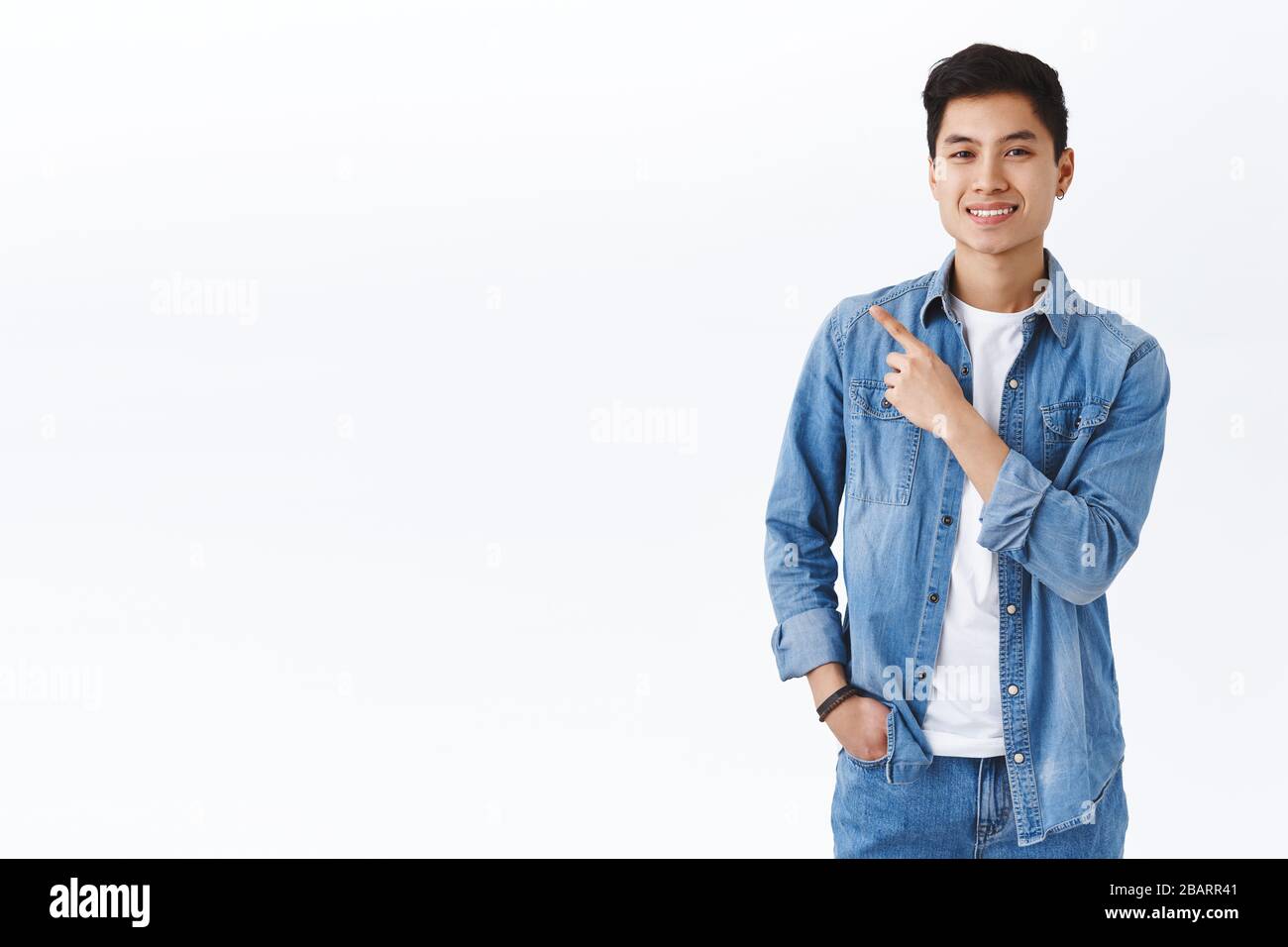Portrait of enthusiastic handsome taiwanese man in denim jacket ...