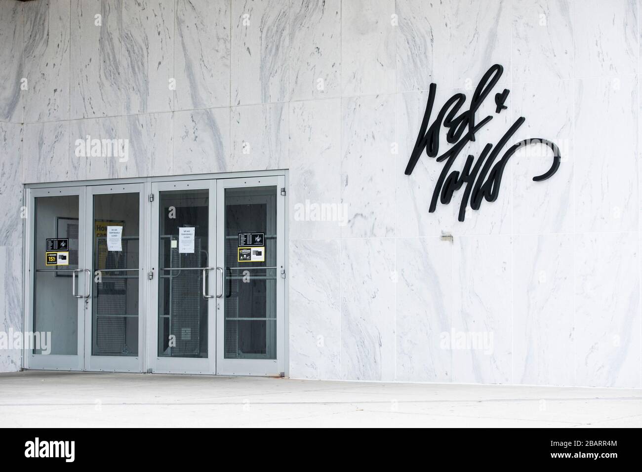 A logo sign outside of a Lord & Taylor retail store location in Fairfax ...