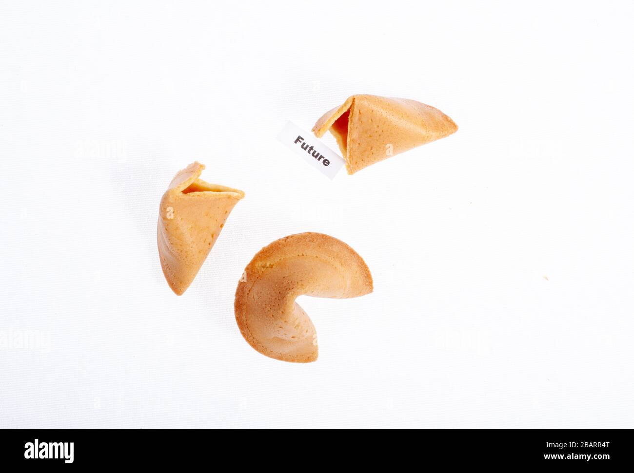 fortune cookie cracked open on white background with the word future ...