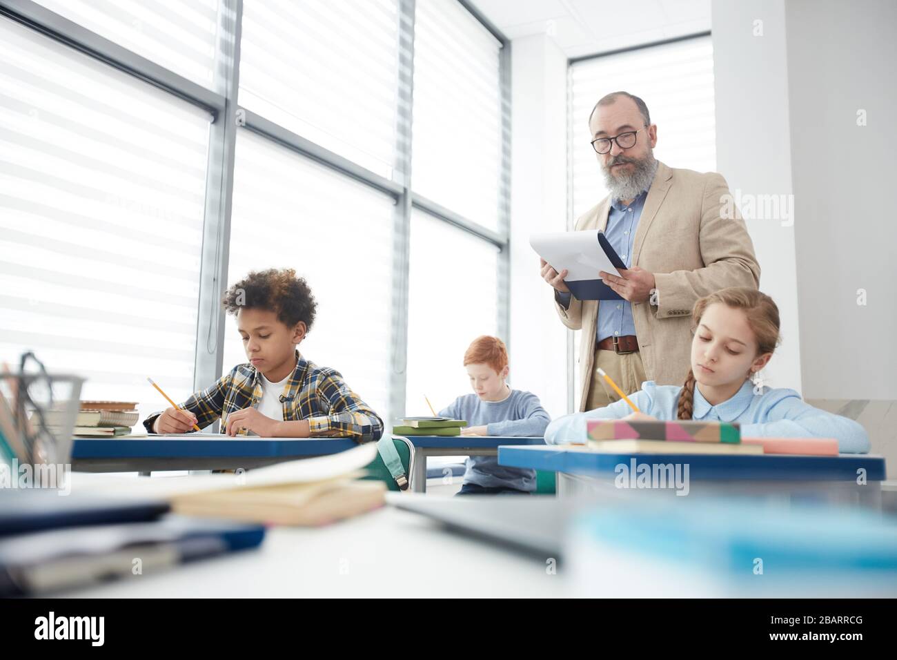 Rows of children sitting in school hi-res stock photography and images ...